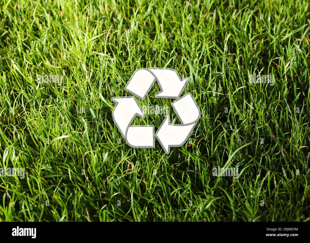 Green grass and illustration of recycling symbol Stock Photo - Alamy