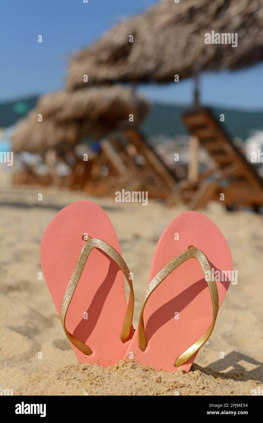 Flip flops in sand hi-res stock photography and images - Alamy