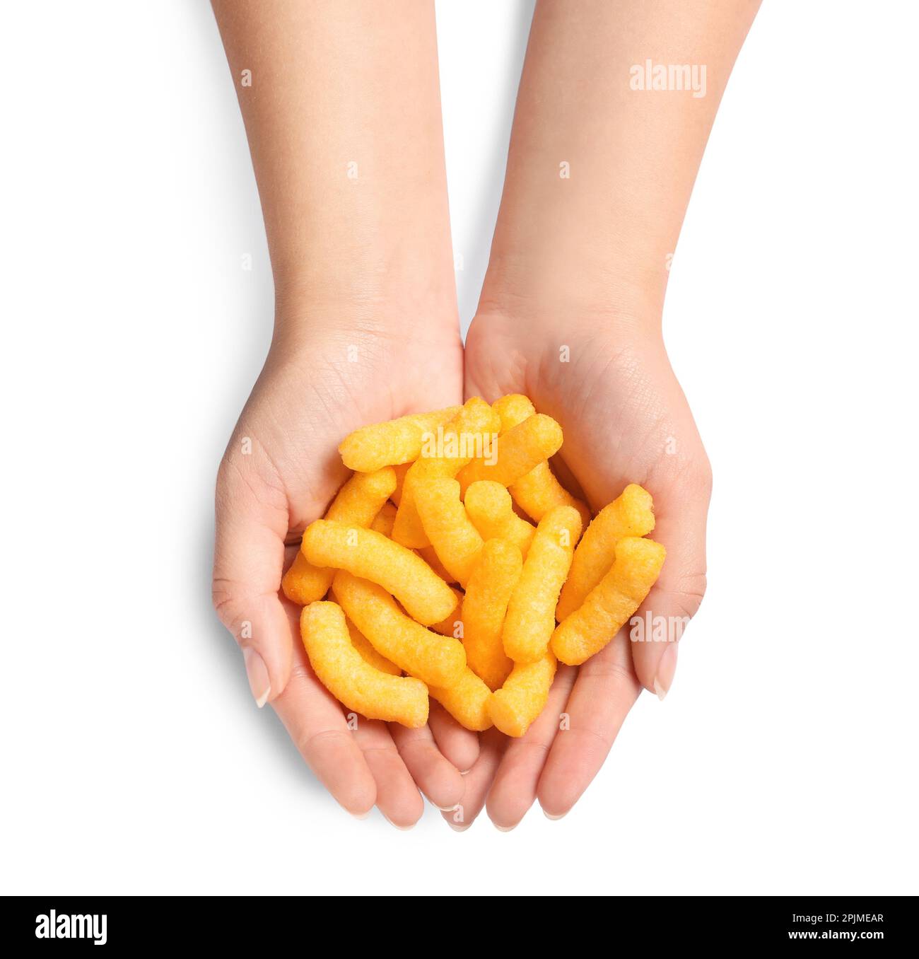 Woman holding pile of crunchy cheesy corn sticks on white background ...