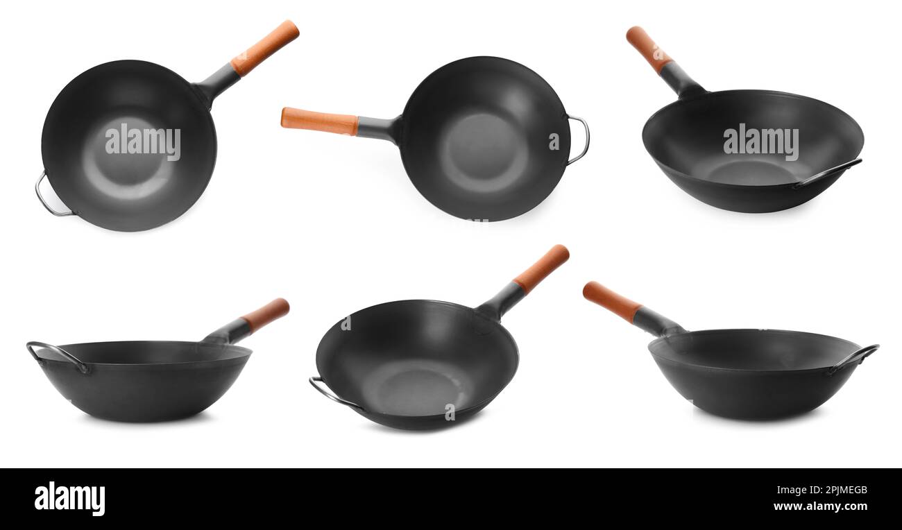 Set with empty woks on white background Stock Photo - Alamy