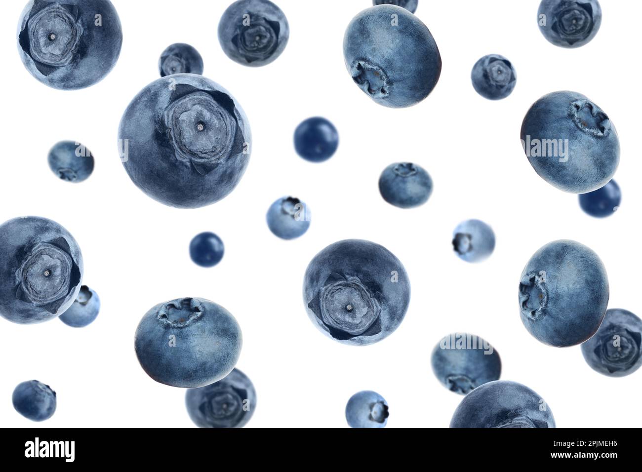 Tasty ripe blueberries flying on white background Stock Photo - Alamy