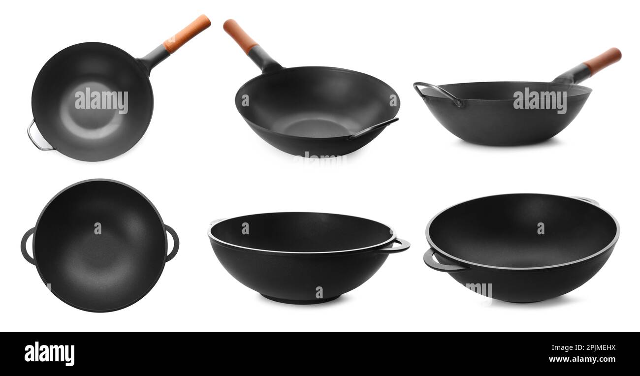 Set with empty woks on white background Stock Photo - Alamy