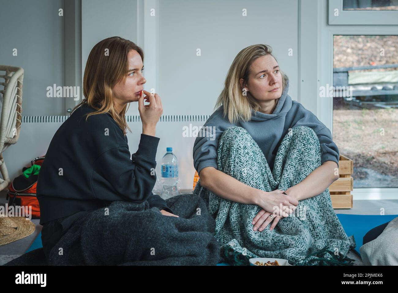 Young caucasian beautiful girls enjoying time together during a yoga ...
