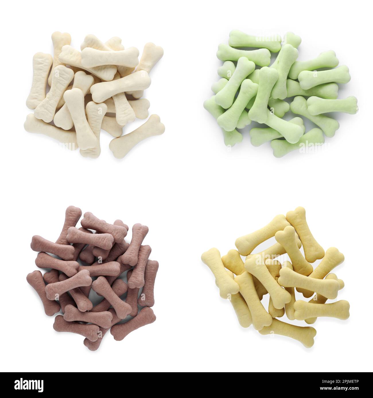 Set with piles of different bone shaped dog cookies on white background ...