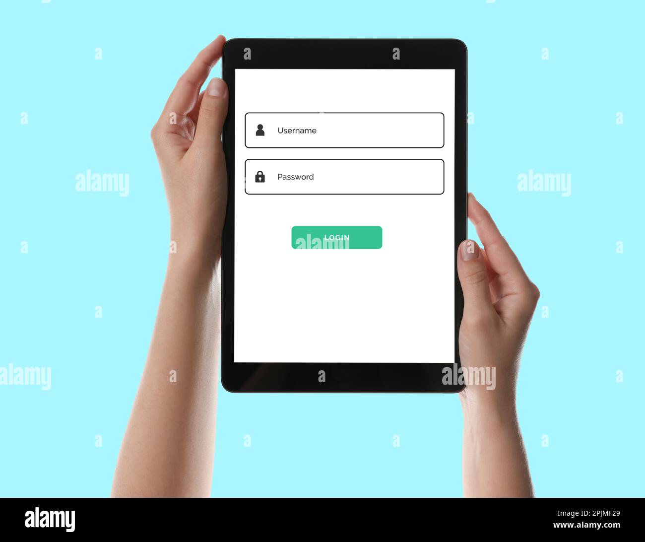 Woman holding tablet with authorization interface on screen against ...