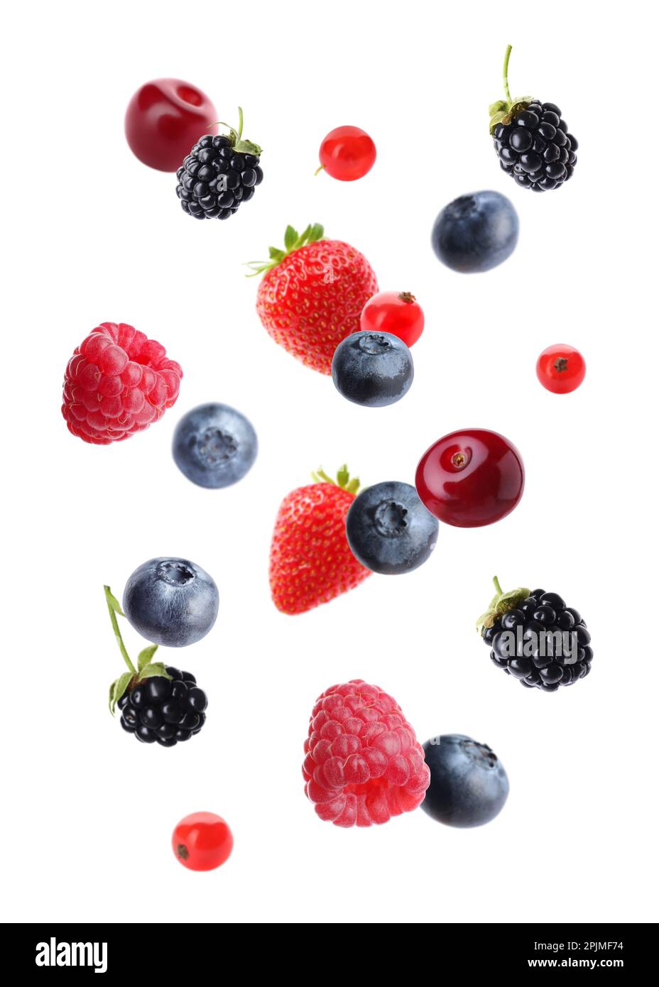 Different tasty ripe berries falling on white background Stock Photo ...