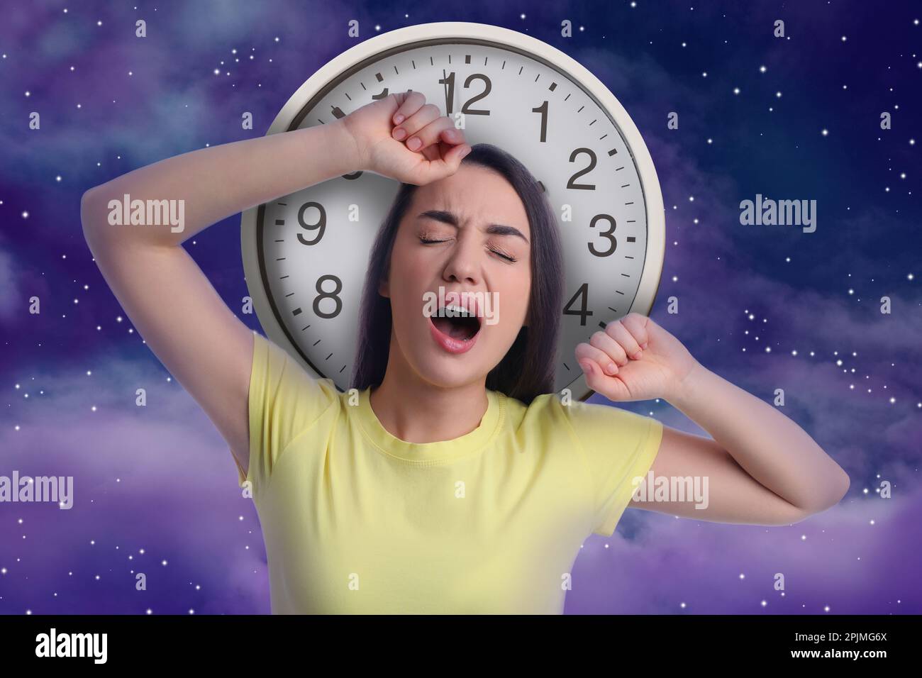 Young tired woman, clock and beautiful starry sky at night on ...