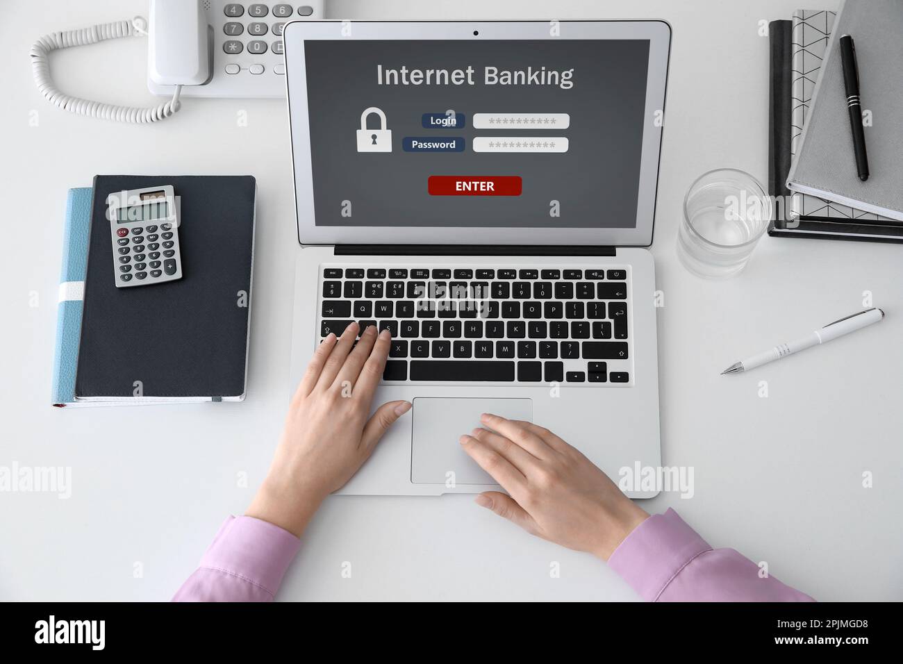 Woman using online banking application on laptop at white table, top ...