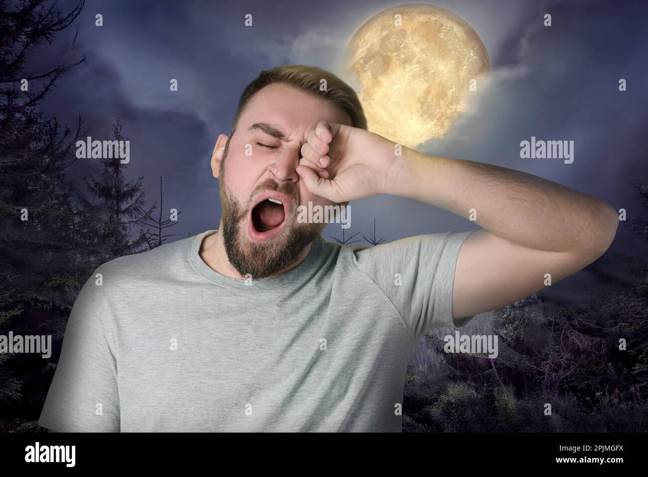 Sleepy young man and beautiful view of full moon in night sky Stock ...