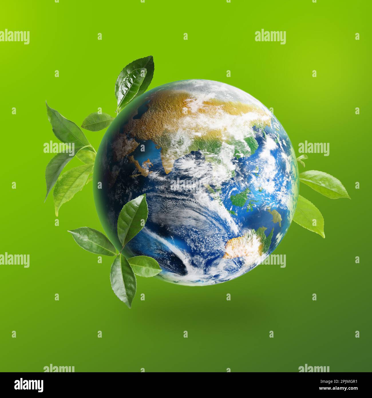 Recycling concept. Earth planet with green leaves on color background ...