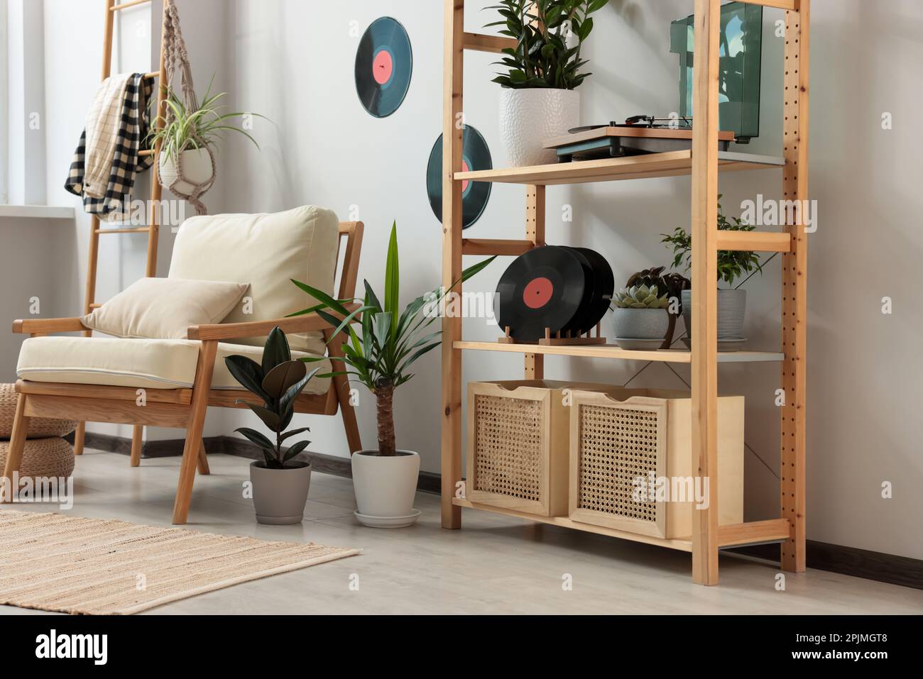 Living room interior with stylish turntable on wooden shelving unit and ...
