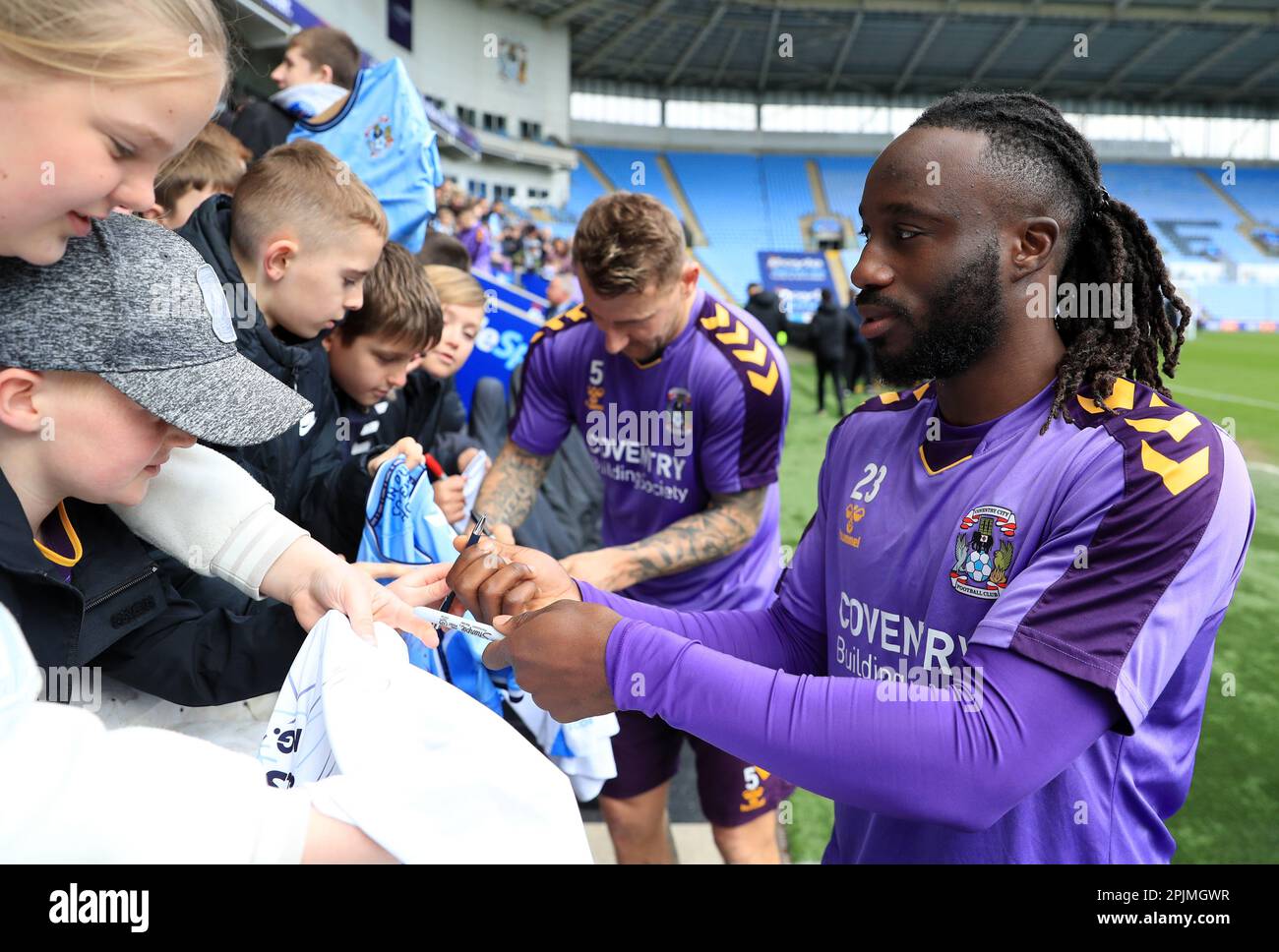 Coventry City's Fankaty Dabo signs for fans after training at Coventry ...