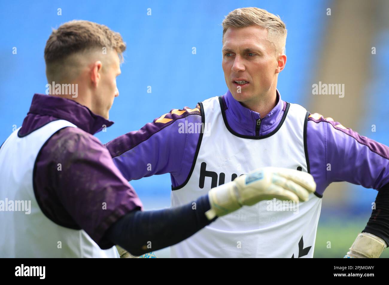 Coventry City goalkeeper Simon Moore 9right speaks with Ben Wilson ...