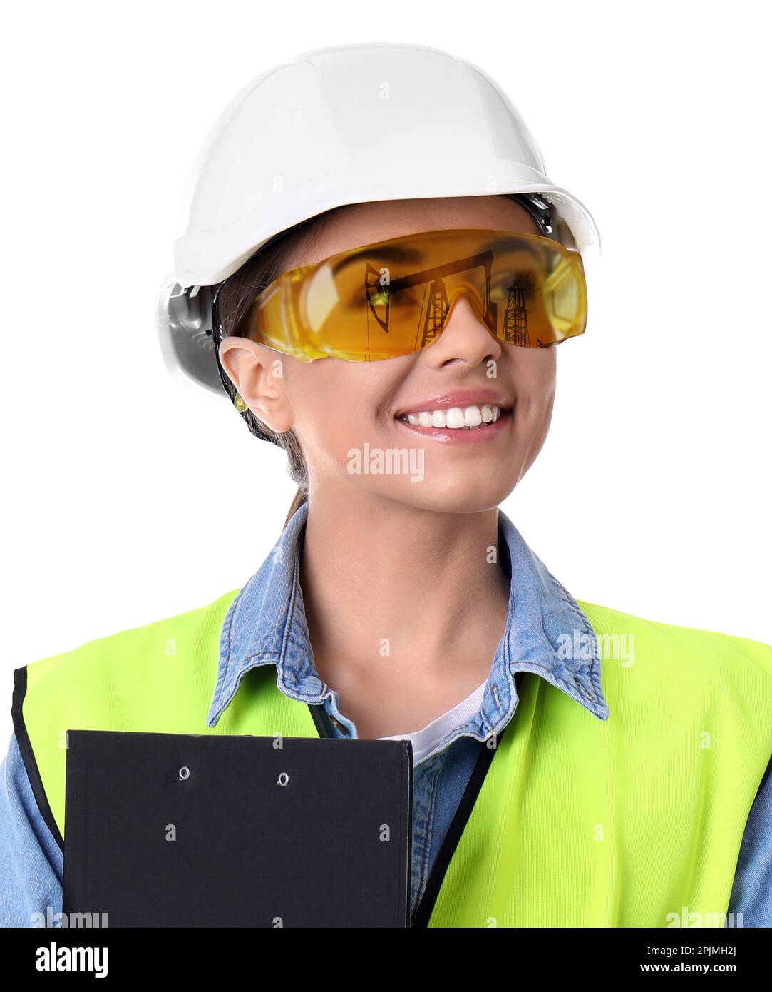 Woman wearing uniform and reflection of crude oil pumps in her goggles ...