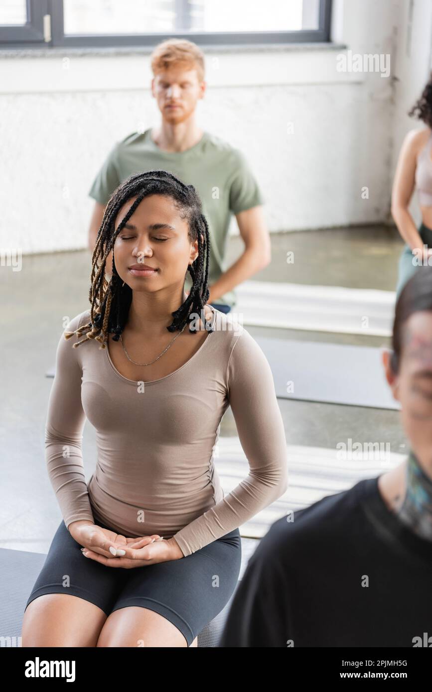 African american woman meditating hi-res stock photography and images ...