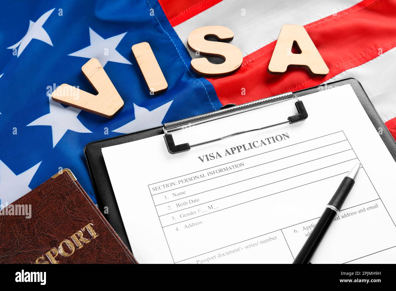 Word Visa, application form and passport on American flag. Immigration ...
