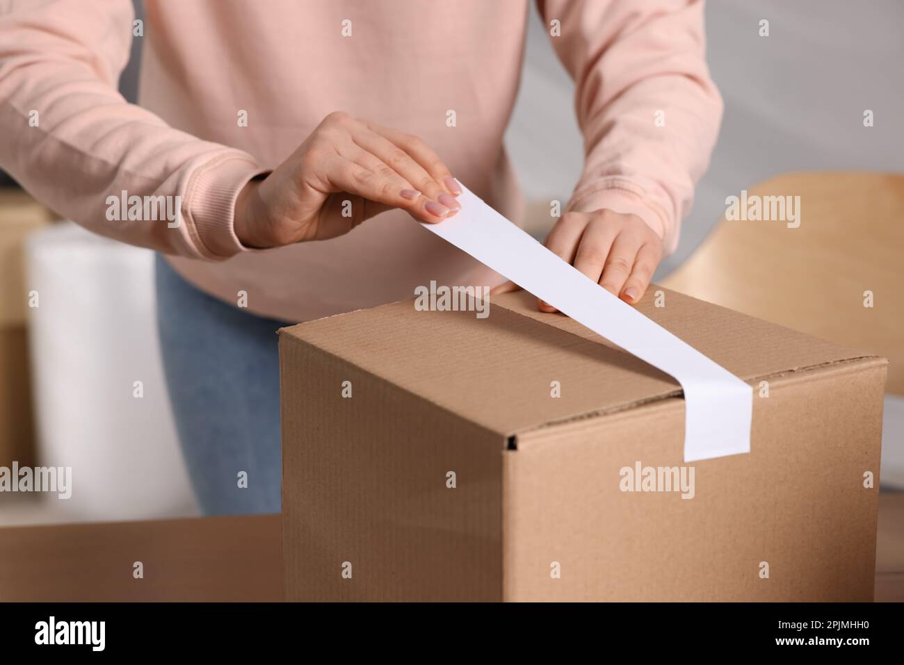 Hands worker taping box parcel hi-res stock photography and images - Alamy