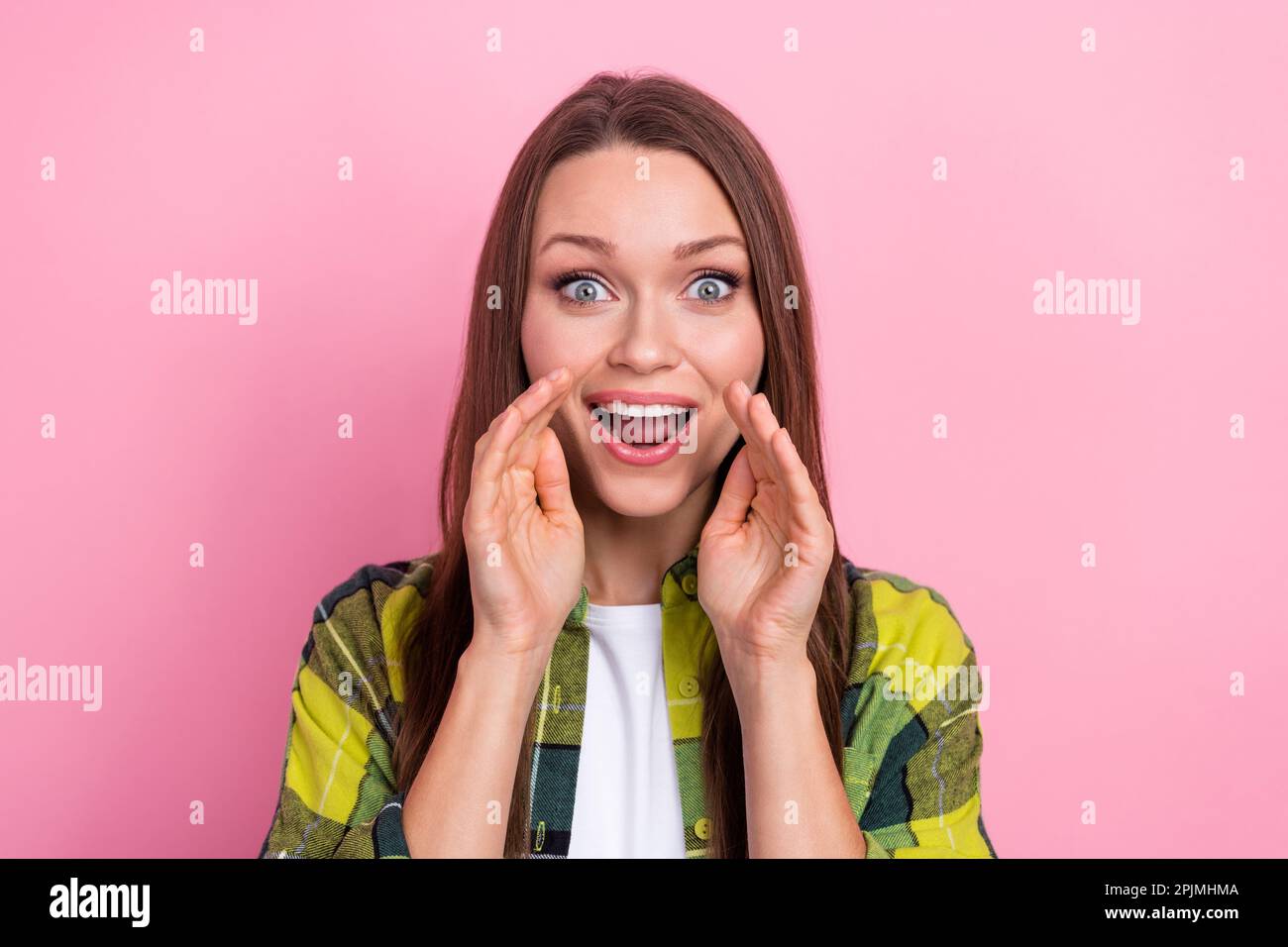 Photo of cheerful funky girl hands near mouth say tell news information ...
