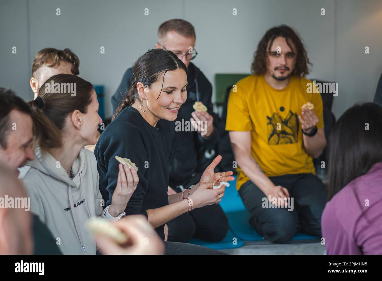 Group of young beautiful people enjoying time together and eating vegan ...