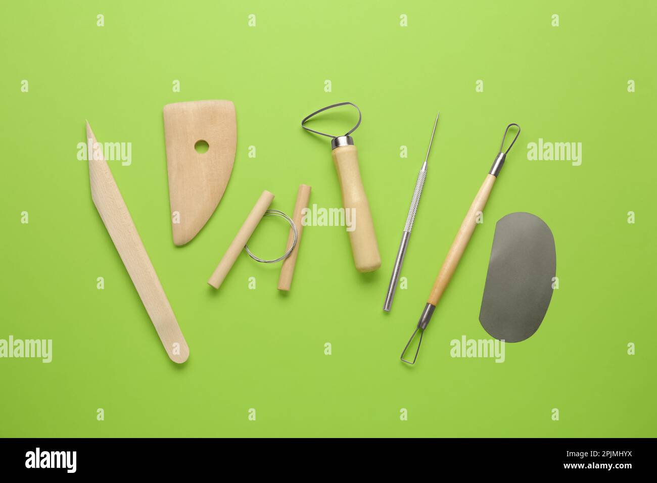 Set of clay modeling tools on green background, flat lay Stock Photo ...