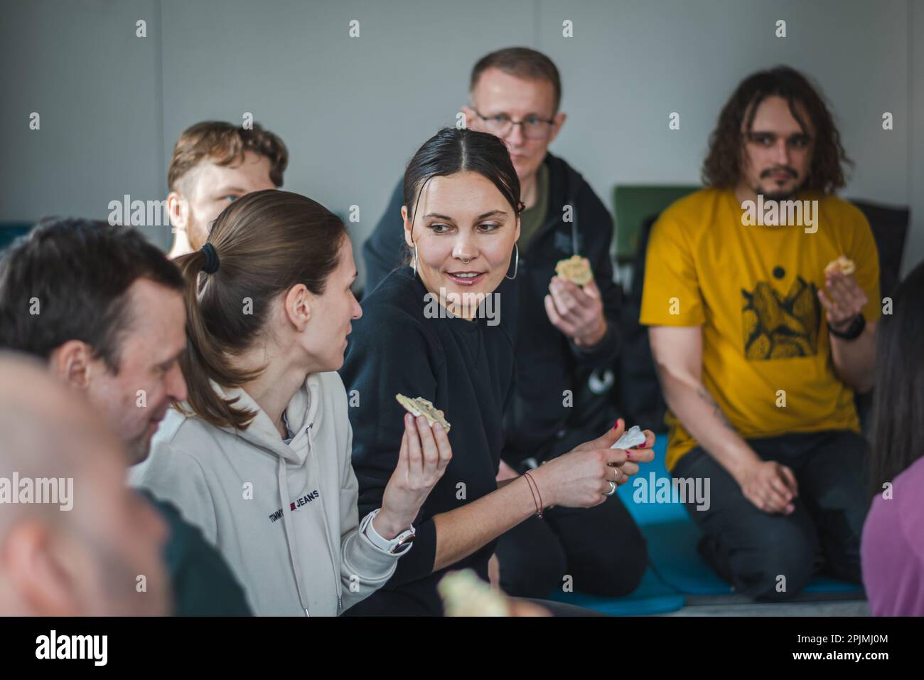 Group of young beautiful people enjoying time together and eating vegan ...
