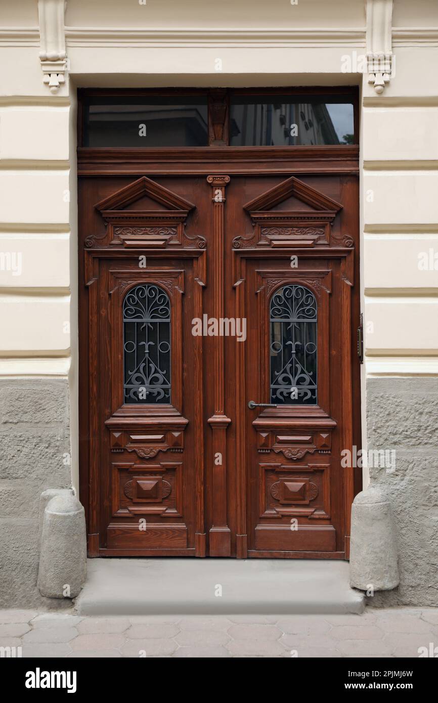 View of building with big vintage wooden door. Exterior design Stock ...