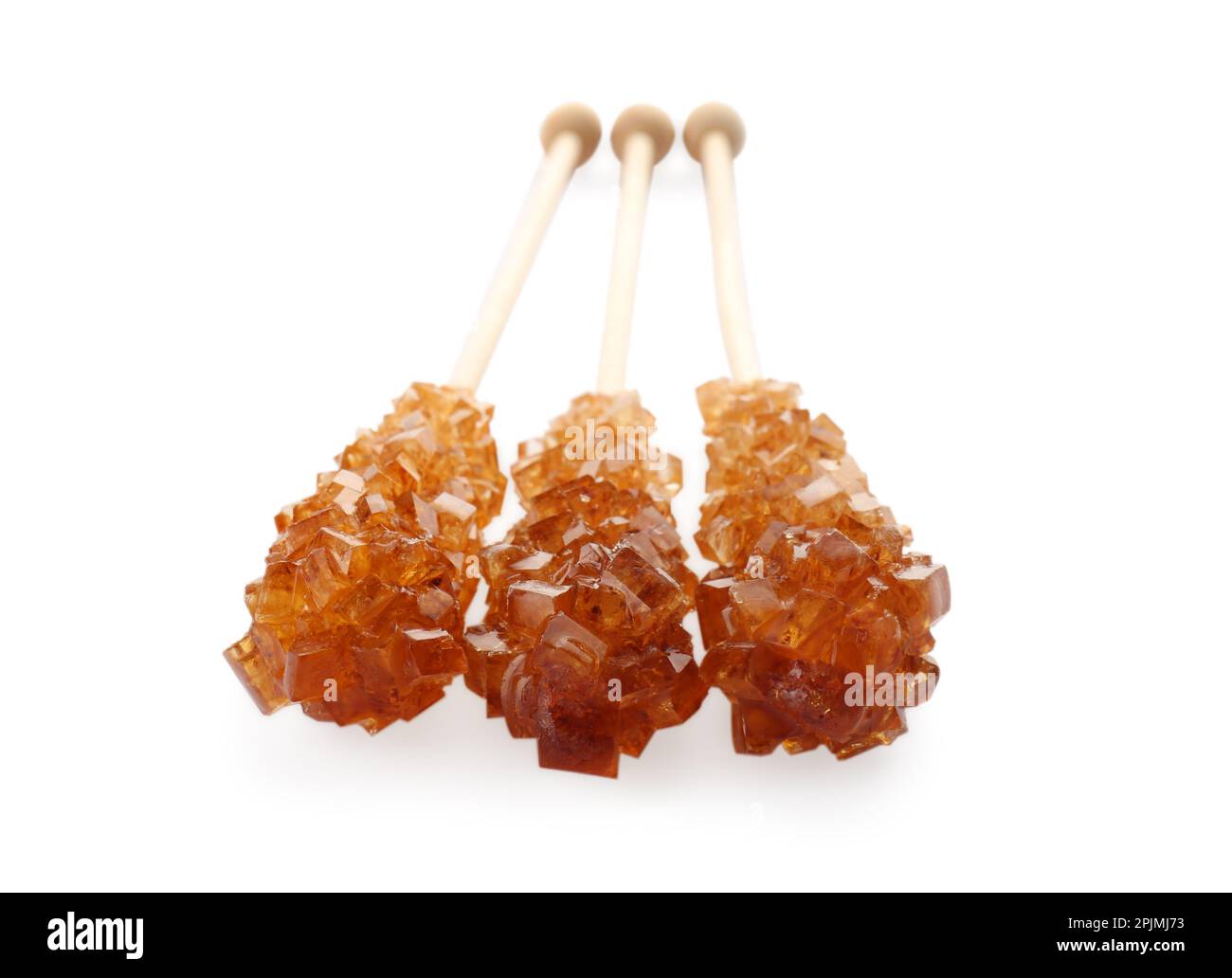 Wooden sticks with sugar crystals isolated on white. Tasty rock candies ...