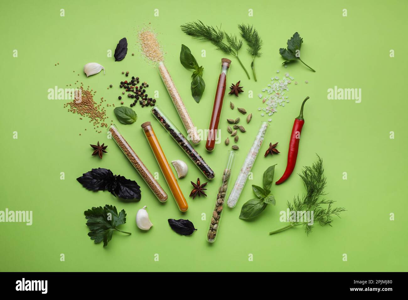 Flat lay composition with various spices, test tubes and fresh herbs on ...