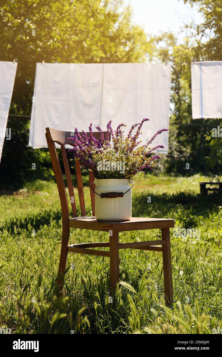 Flowers on chair hi-res stock photography and images - Alamy