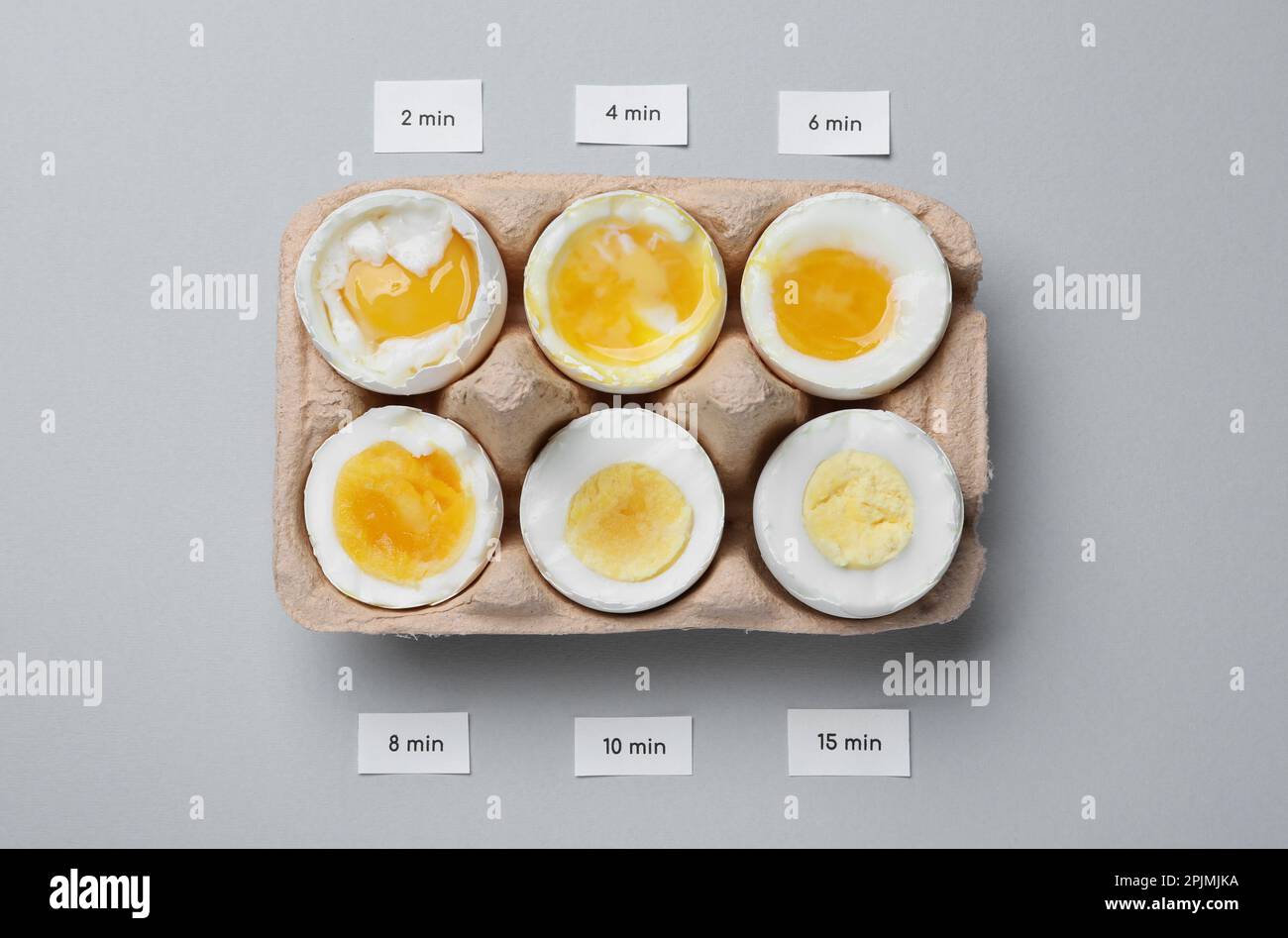 Different cooking time and readiness stages of boiled chicken eggs on ...
