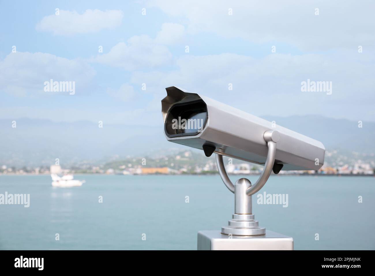Metal tower viewer installed near sea, space for text. Mounted ...