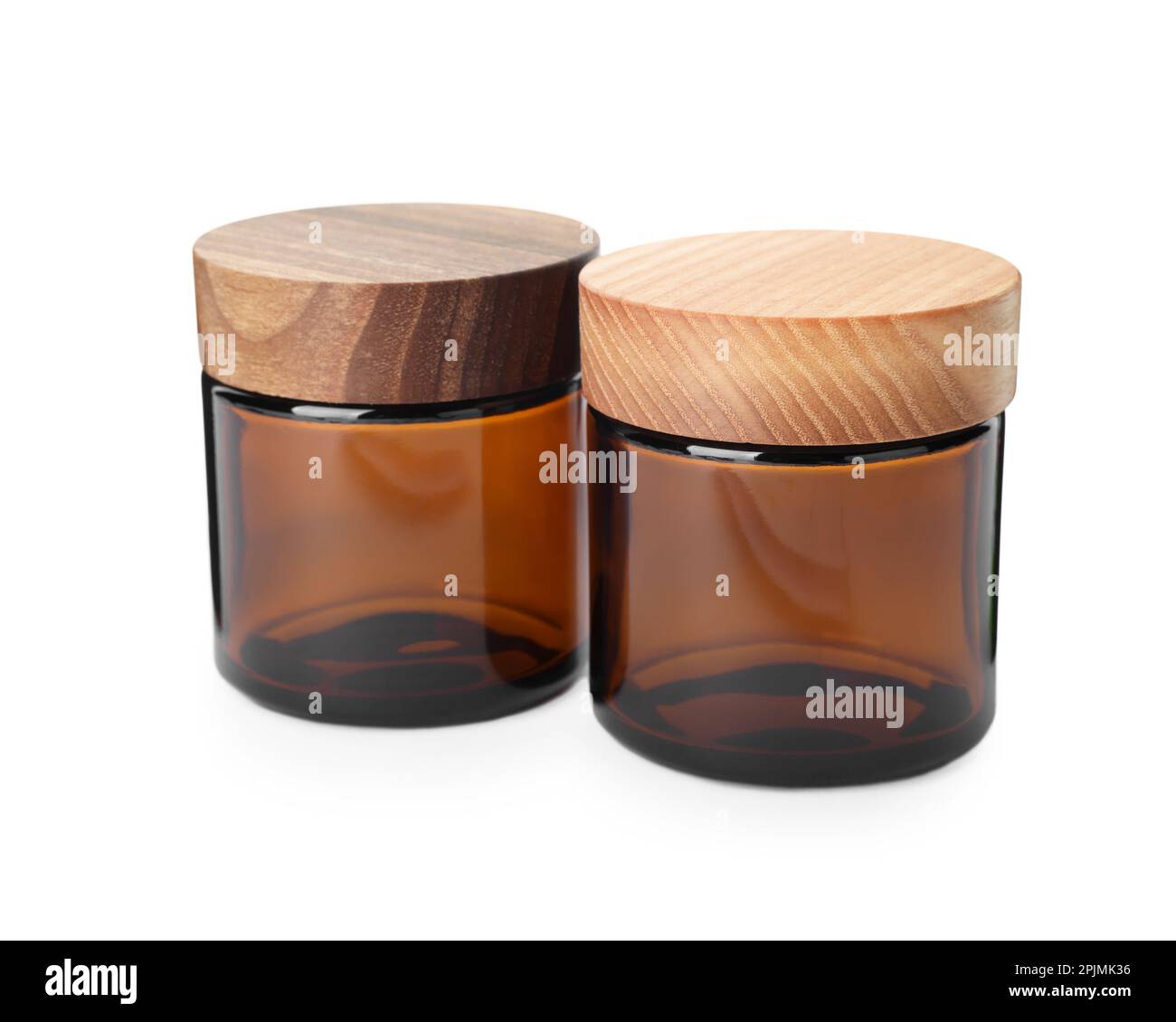 Two empty glass jars with wooden lids isolated on white Stock Photo - Alamy