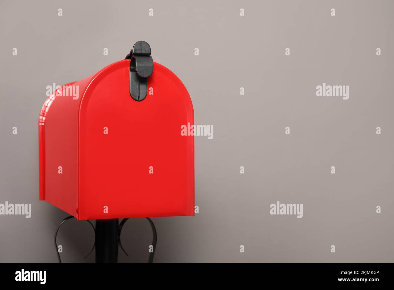 Closed red letter box against grey background. Space for text Stock ...
