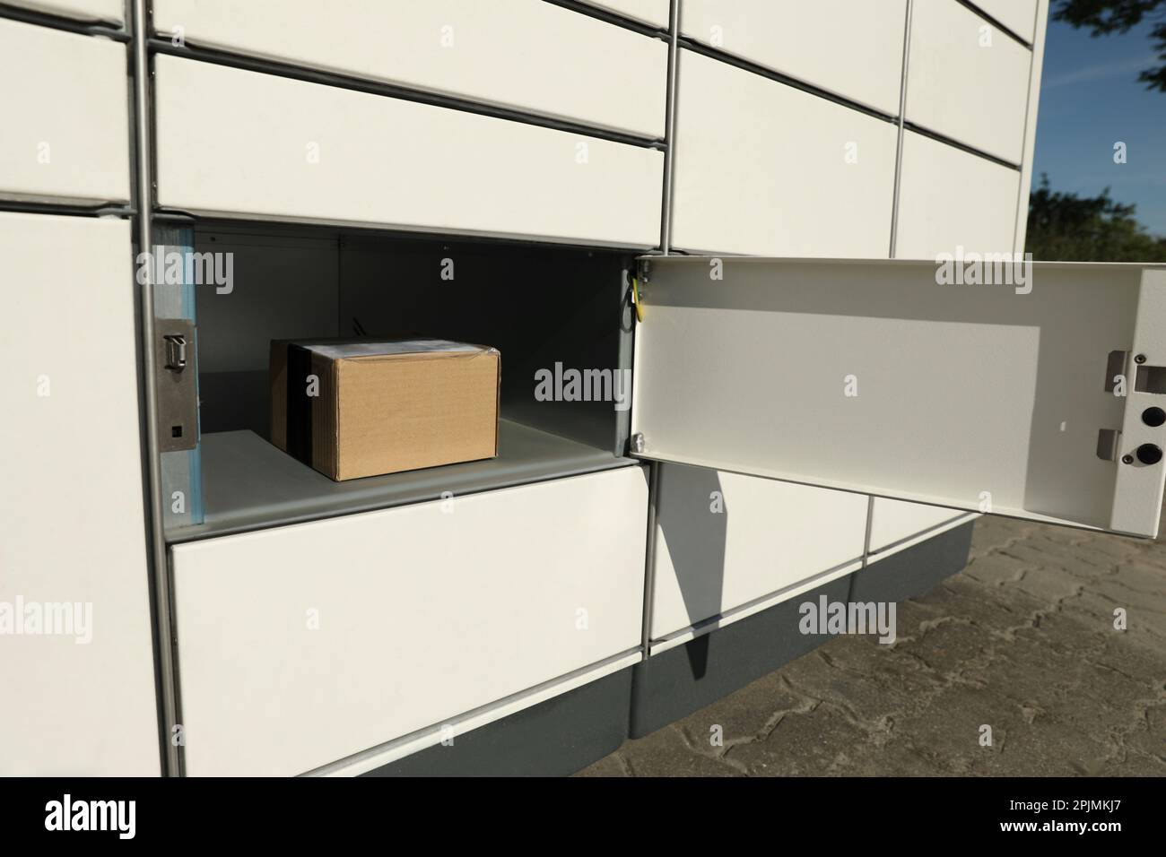 Open box with package in parcel locker Stock Photo - Alamy