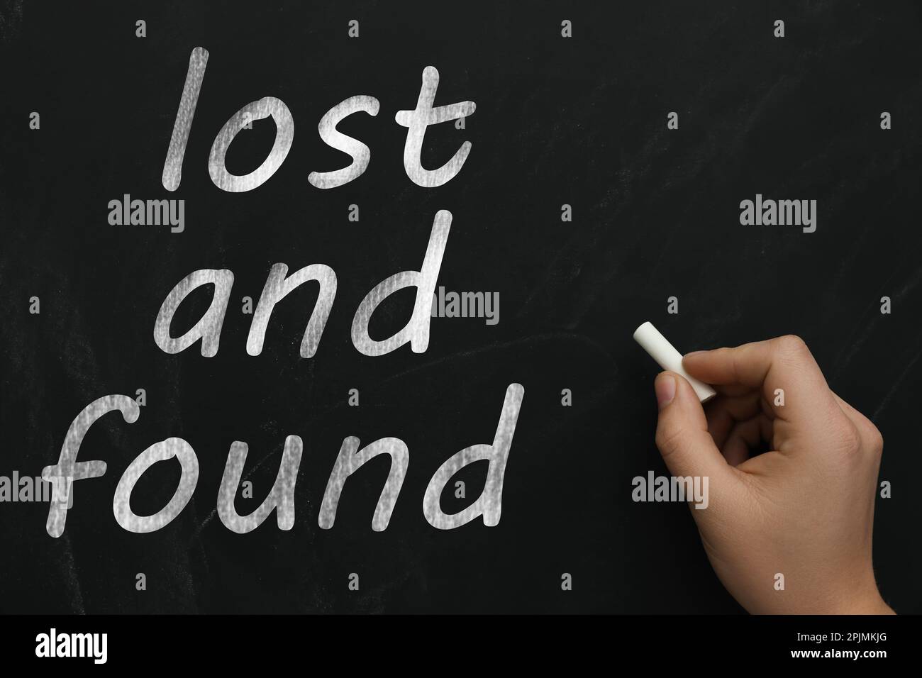 Woman write phrase Lost and Found on blackboard, closeup Stock Photo ...