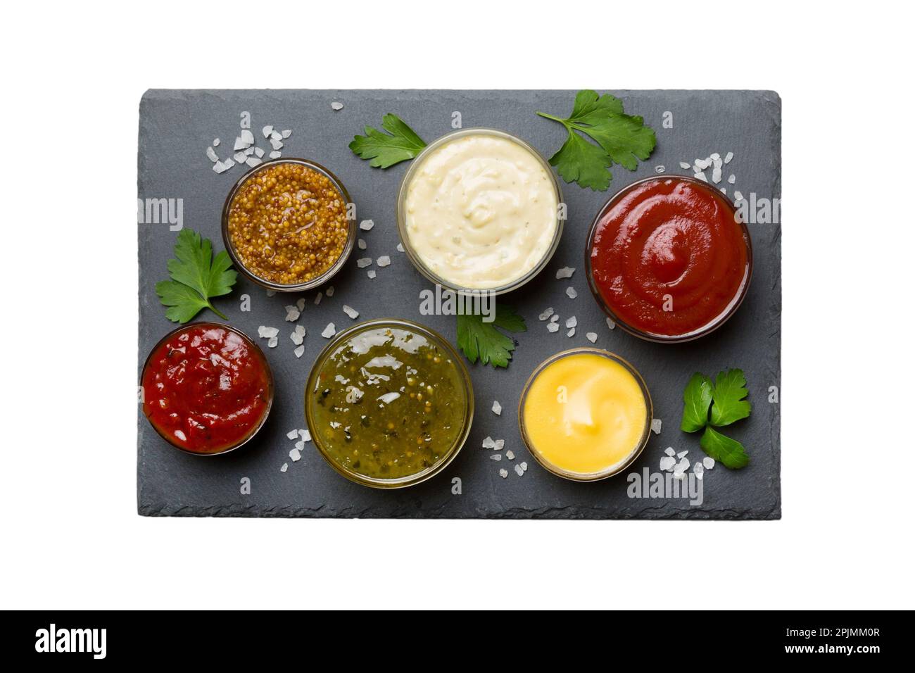 Many different sauces and herbs on table, flat lay top view. sauces on ...