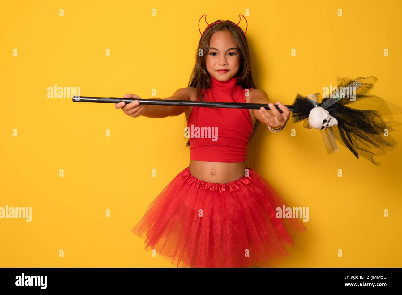 Closeup photo of funny little lady with long hair and headband playing ...