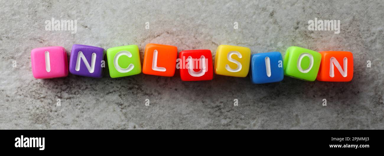 Colorful cubes with word Inclusion on grey background, flat lay. Banner ...