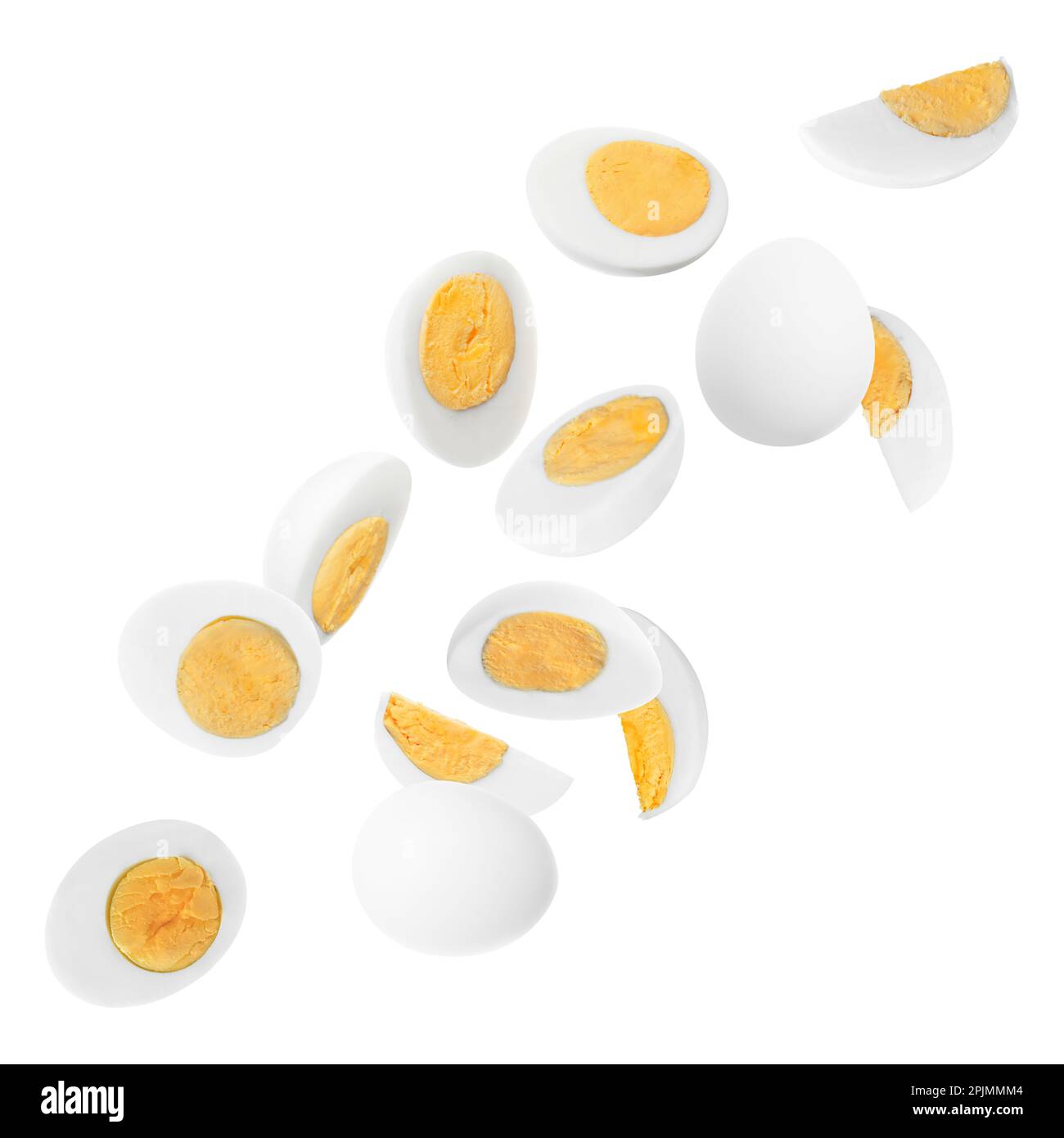 Tasty hard boiled eggs falling on white background Stock Photo - Alamy