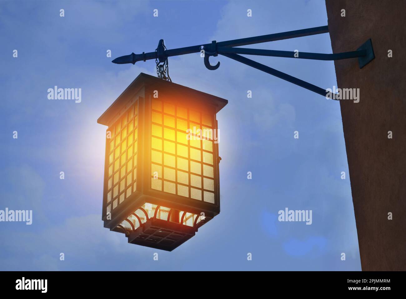 Beautiful old fashioned street lamp lighting on wall of building Stock ...