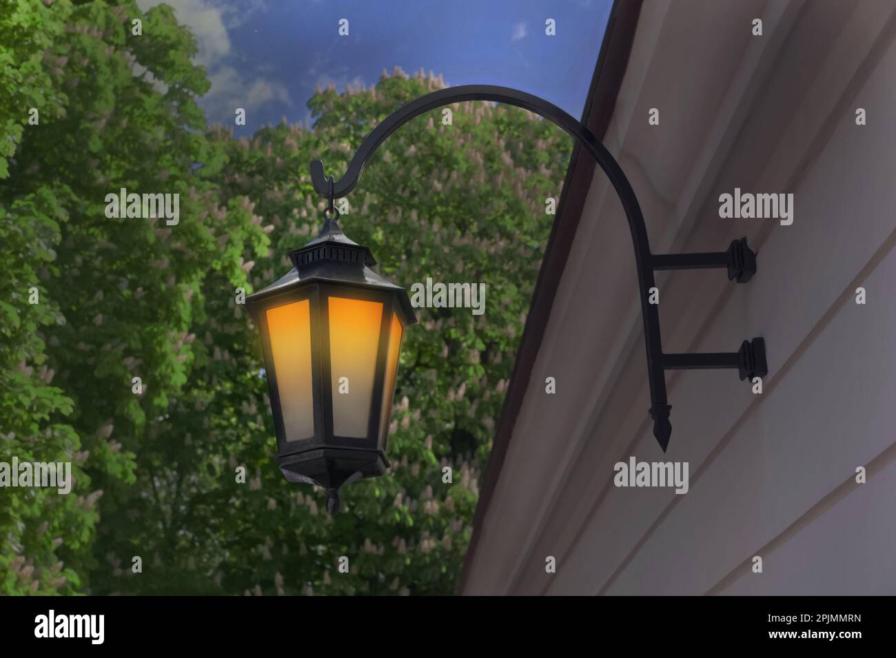 Beautiful old fashioned street lamp lighting on wall of building Stock ...