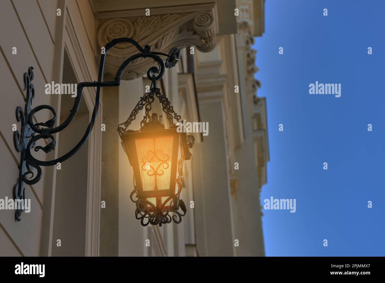 Beautiful old fashioned street lamp lighting on wall of building Stock ...