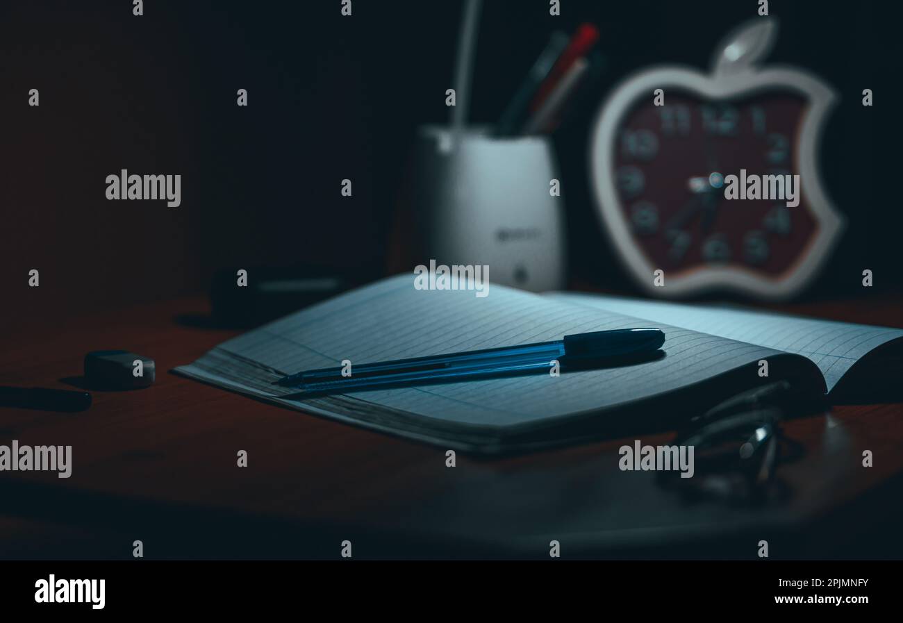 study table at night Stock Photo - Alamy