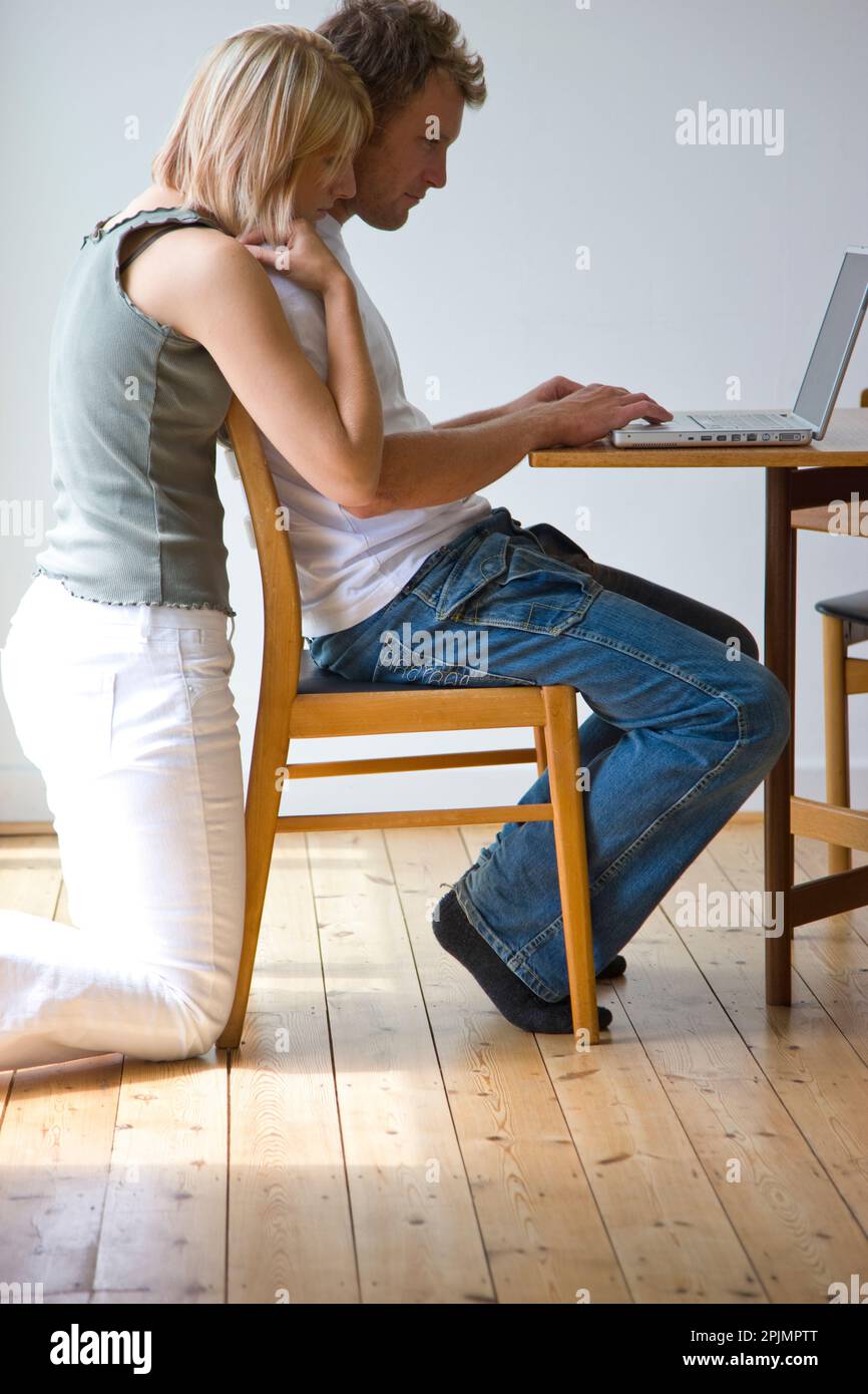 Woman kneeling behind man sitting hi-res stock photography and images ...