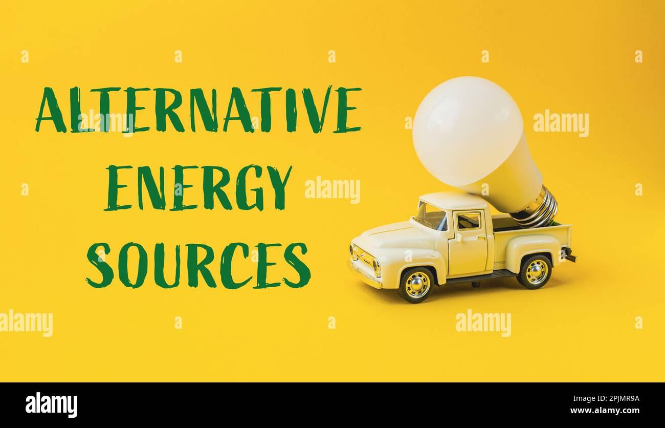 alternative energy sources text on yellow background Stock Photo - Alamy