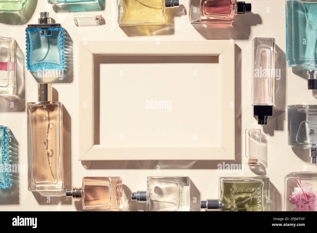 Wooden frame copyspace and perfume bottles , concept for advertising ...