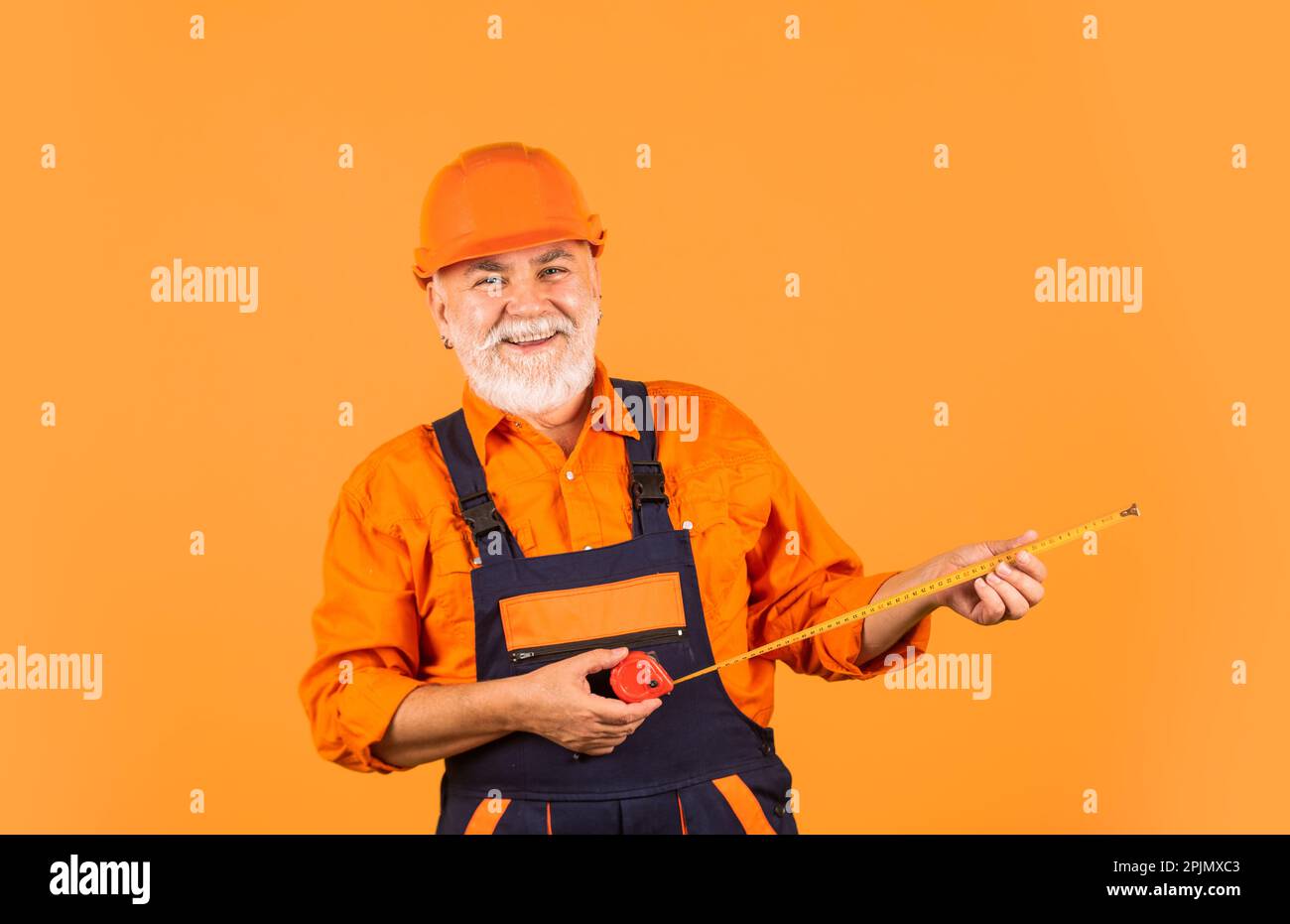 senior builder use tape-line for measure. measurement. engineer size ...