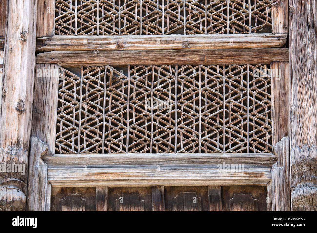 Detail of an old house with lattice wooden window is located in ...