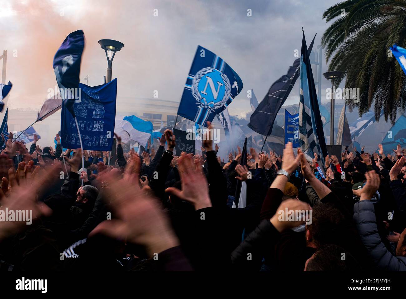 Napoli Ultras outside the stadium with flags and smoke bombs beyond the ...