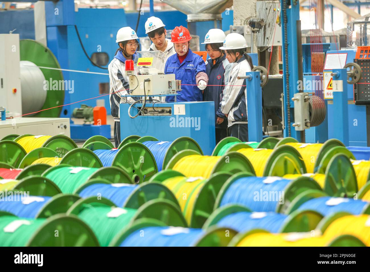HUZHOU, CHINA - APRIL 3, 2023 - A workshop master explains the ...